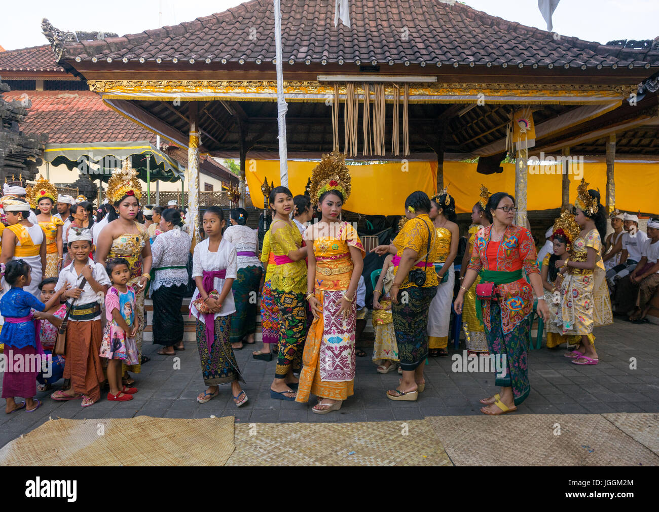 Teenagers in traditional costumes before a tooth filing ceremony taking ...