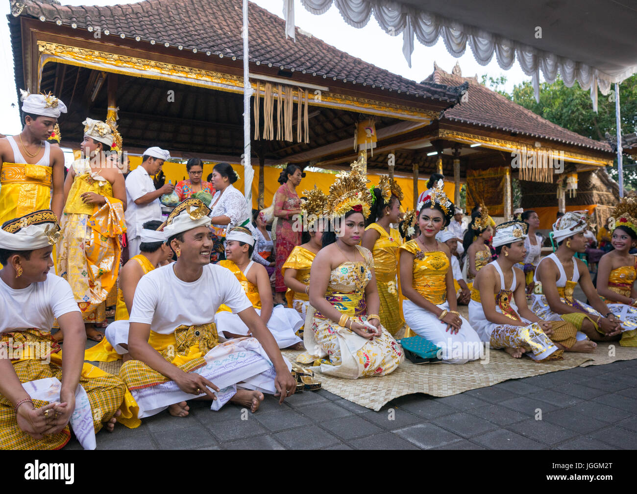 Teenagers in traditional costumes before a tooth filing ceremony taking ...