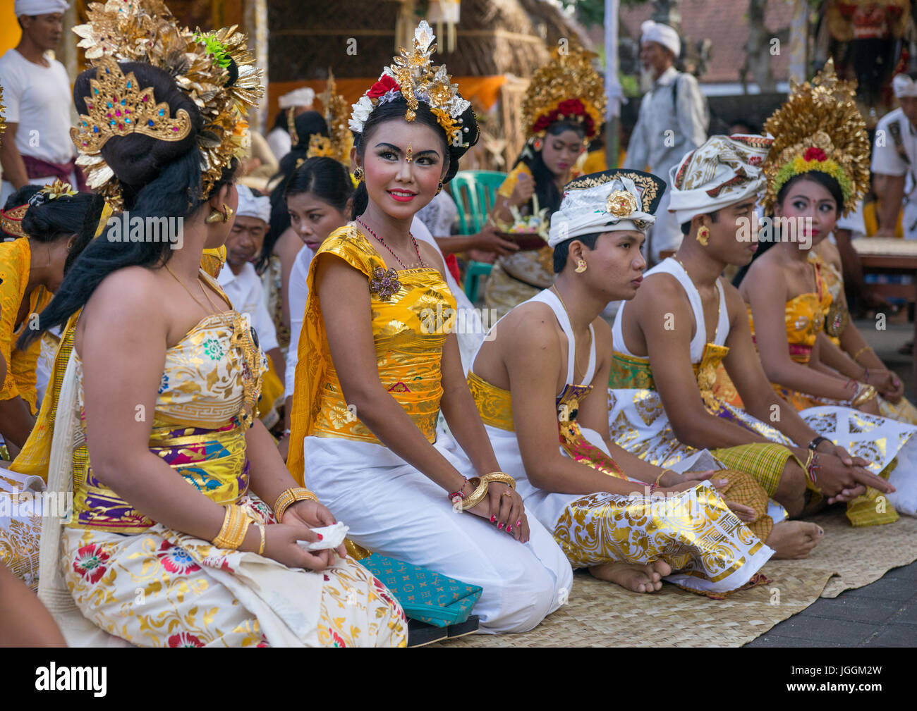 Teenagers in traditional costumes before a tooth filing ceremony taking ...