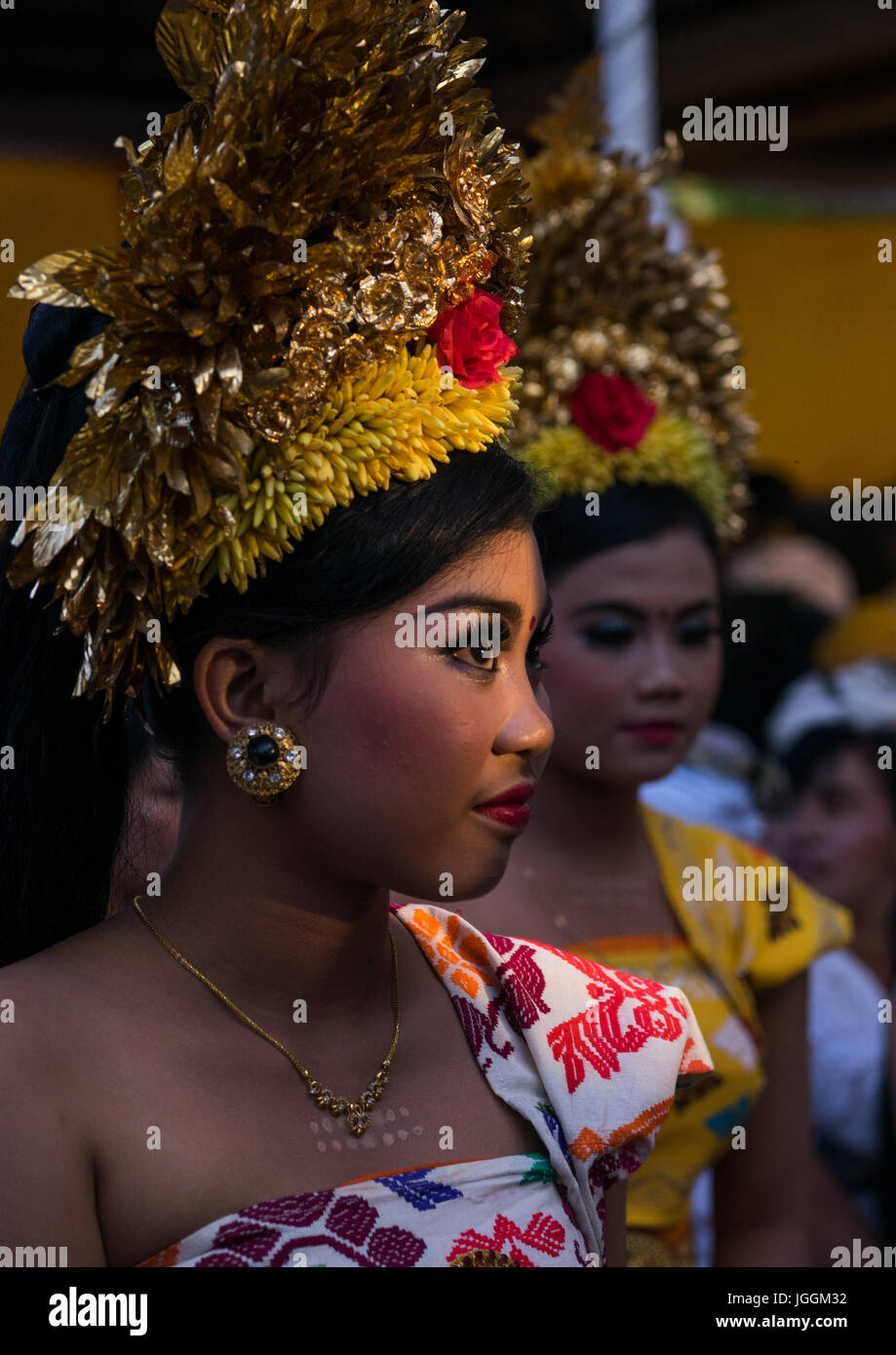 A teenage girl in traditional costume before a tooth filing ceremony ...