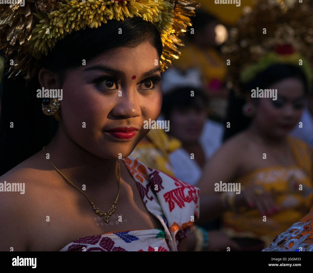 A teenage girl in traditional costume before a tooth filing ceremony ...