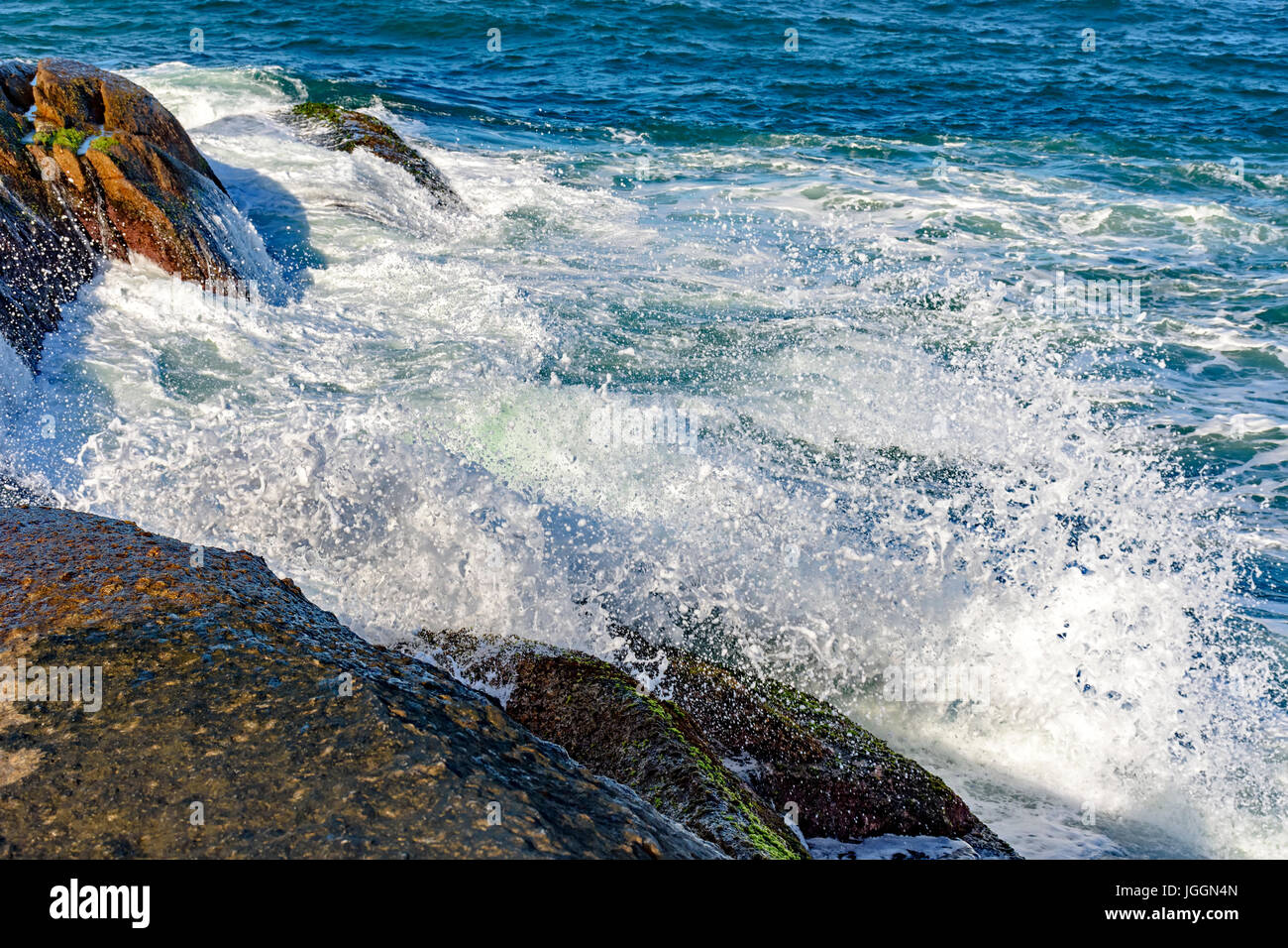 Sea water drops over the stones on the beach Stock Photo - Alamy