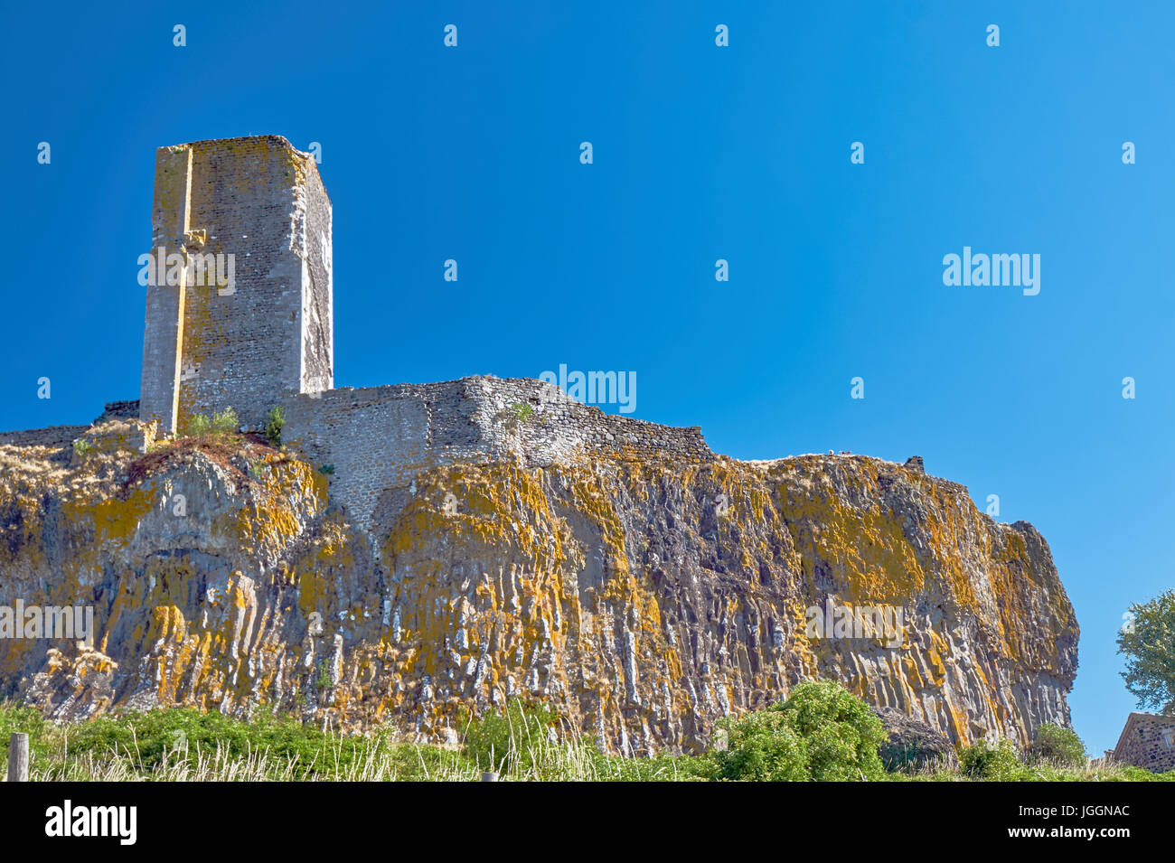 The ruins of the tower of a medieval castle on a rock in France Stock ...