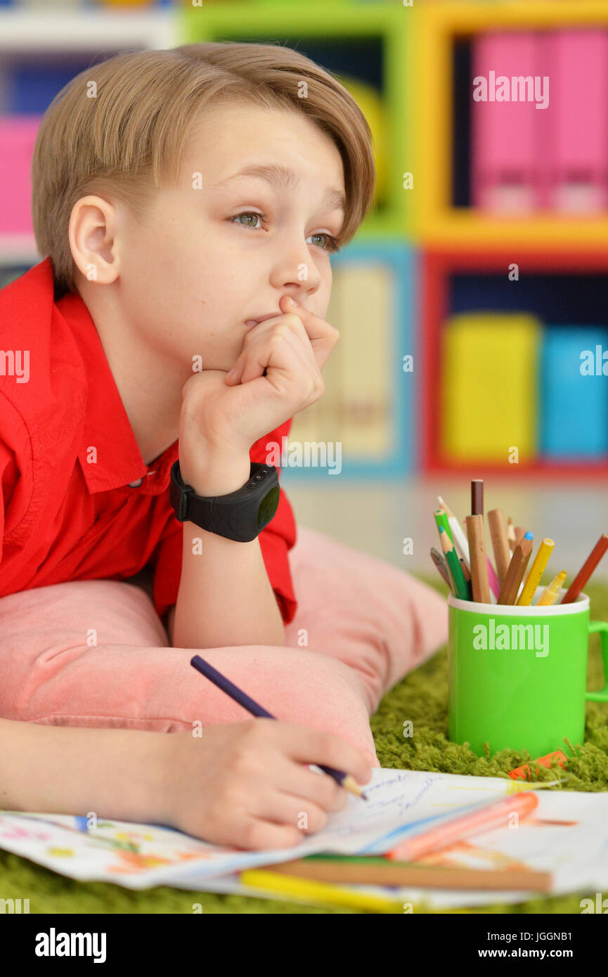 Cute boy drawing with pencils Stock Photo - Alamy