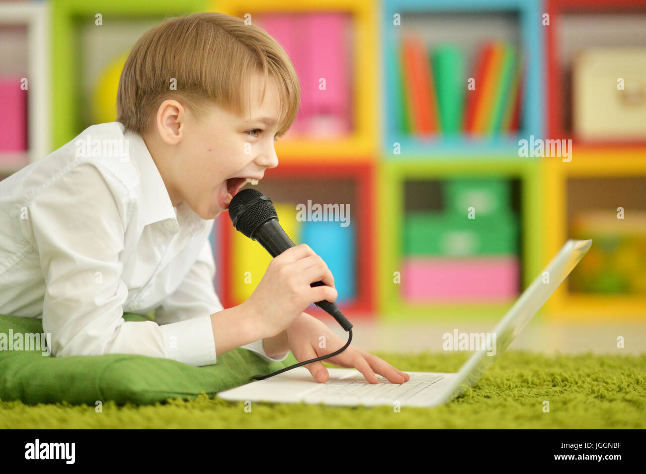 Boy with a laptop Stock Photo - Alamy