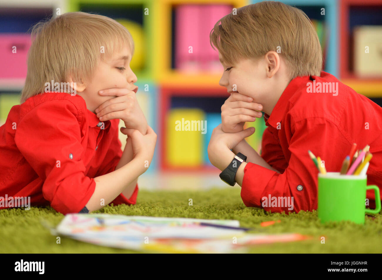 Two brothers draws with pencils Stock Photo - Alamy