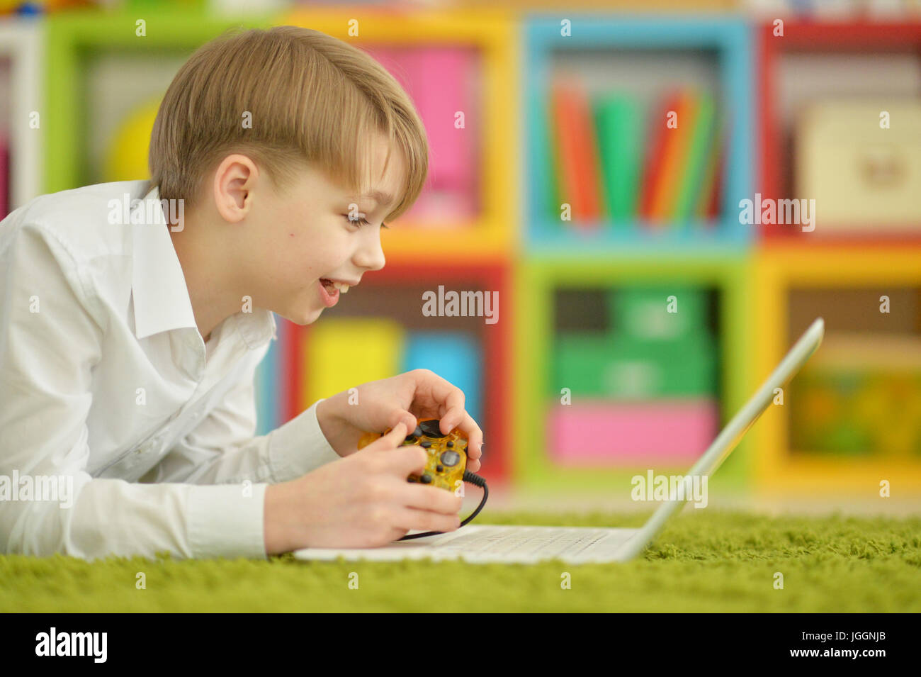 Teenage boy with a laptop Stock Photo - Alamy