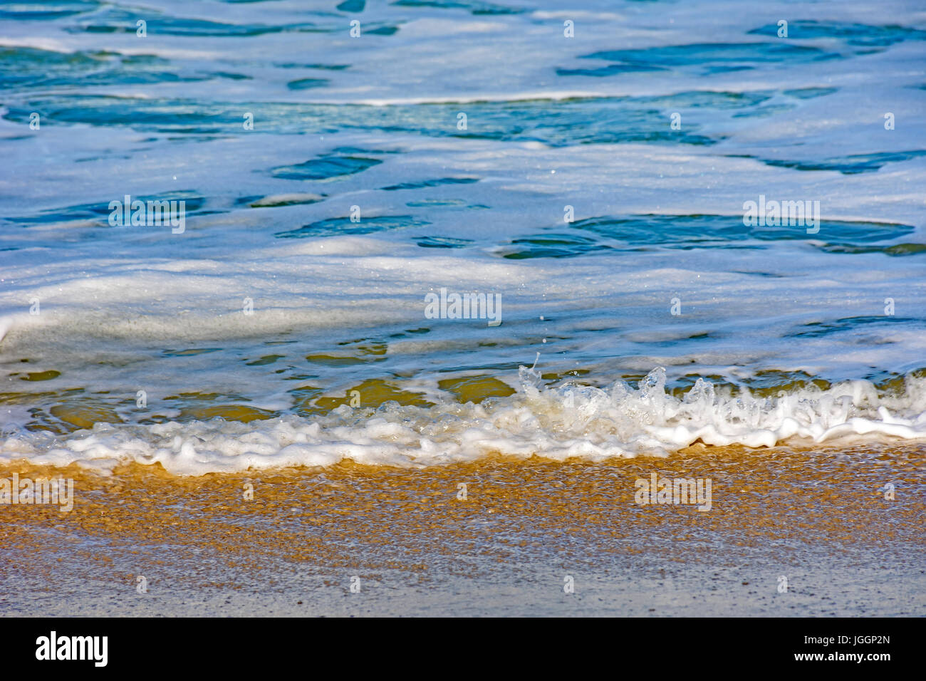 Water over sand in tropical beach Stock Photo - Alamy