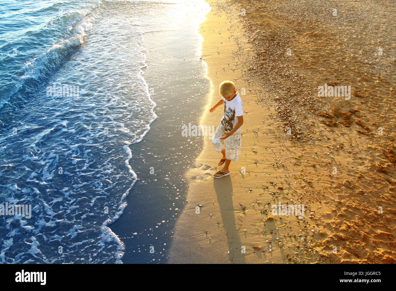 Photo background of a shiny sea shiny sea and a boy on the beach Stock ...