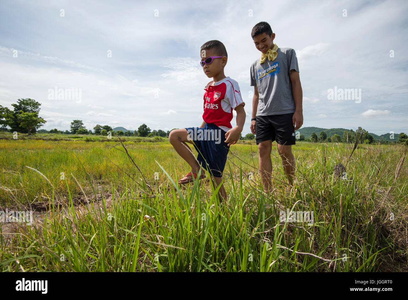 Children playing in rice field hi-res stock photography and images - Alamy