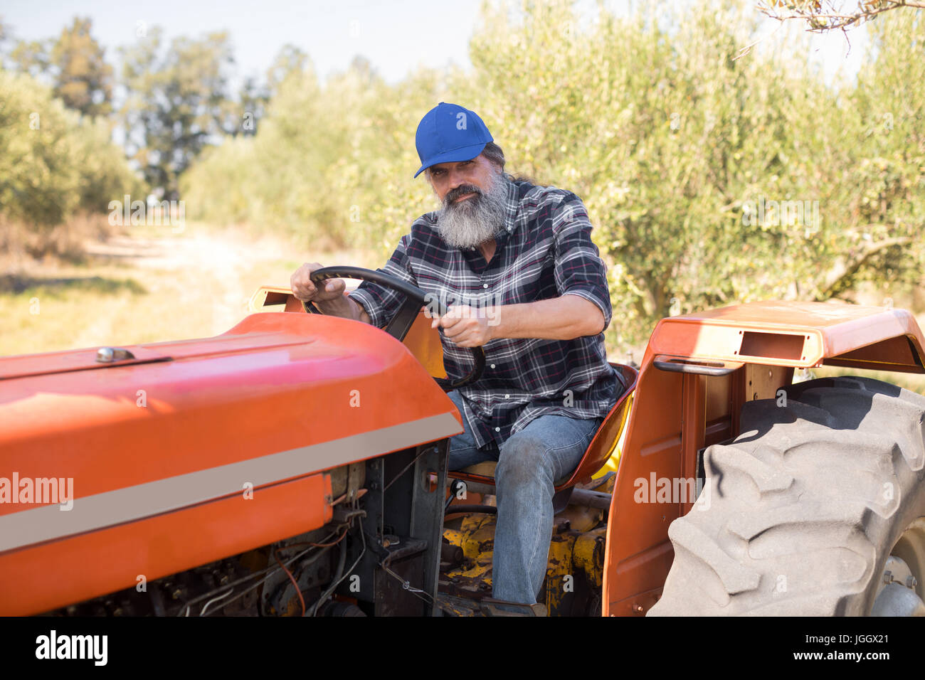Man sitting on tractor hi-res stock photography and images - Alamy