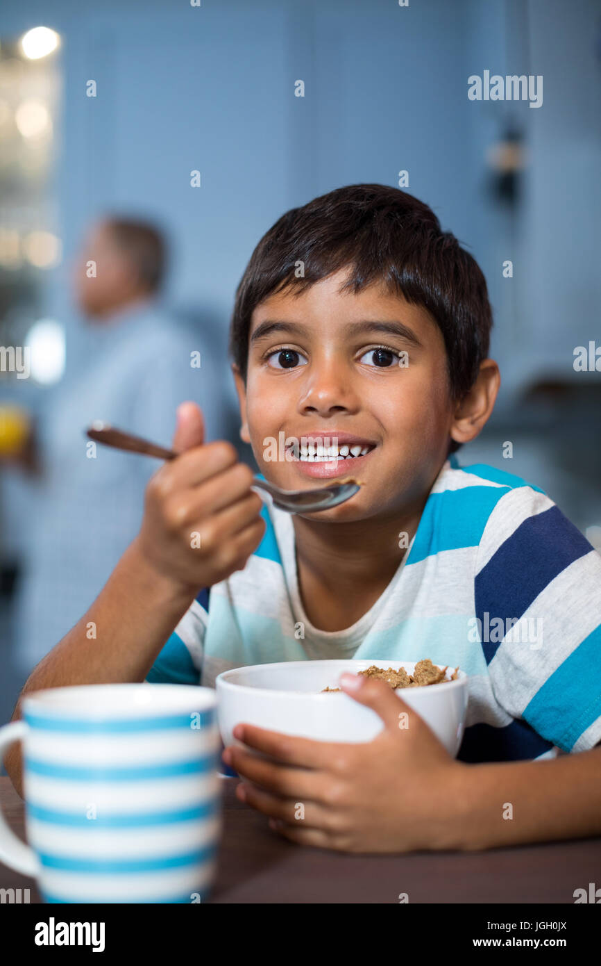 Boy having cereal and milk hi-res stock photography and images - Alamy