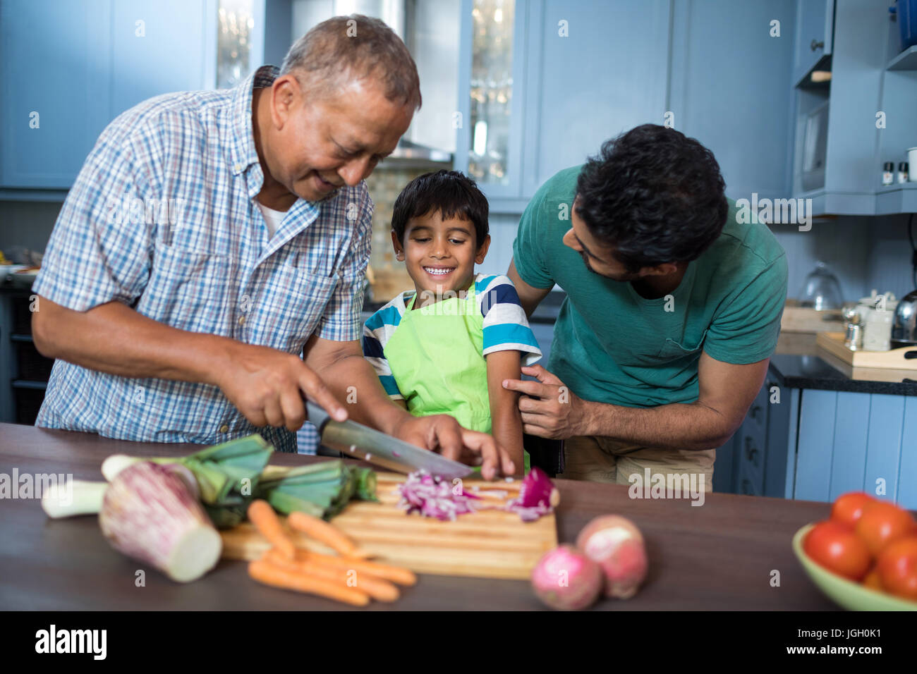 Indian father and son in kitchen hi-res stock photography and images ...
