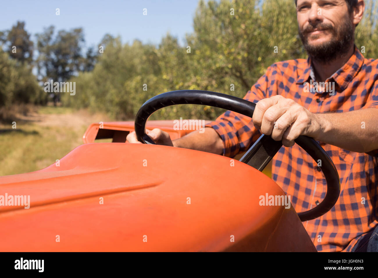 Man driving tractor hi-res stock photography and images - Alamy