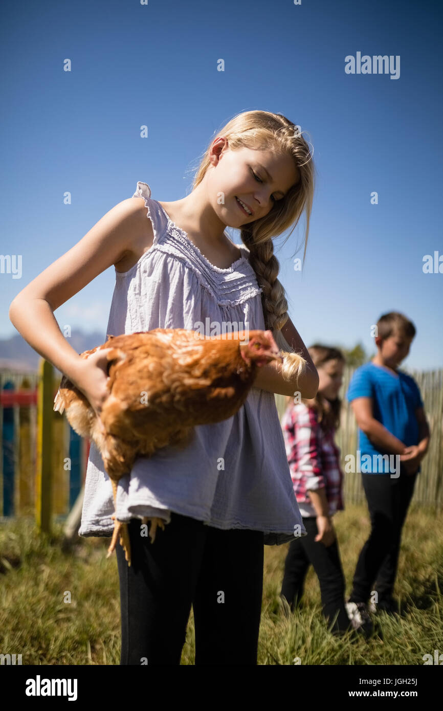 Girl carrying hen hi-res stock photography and images - Alamy