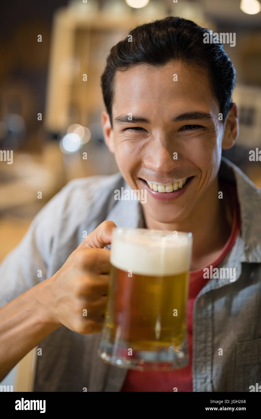 Portrait of man having beer in a restaurant Stock Photo - Alamy