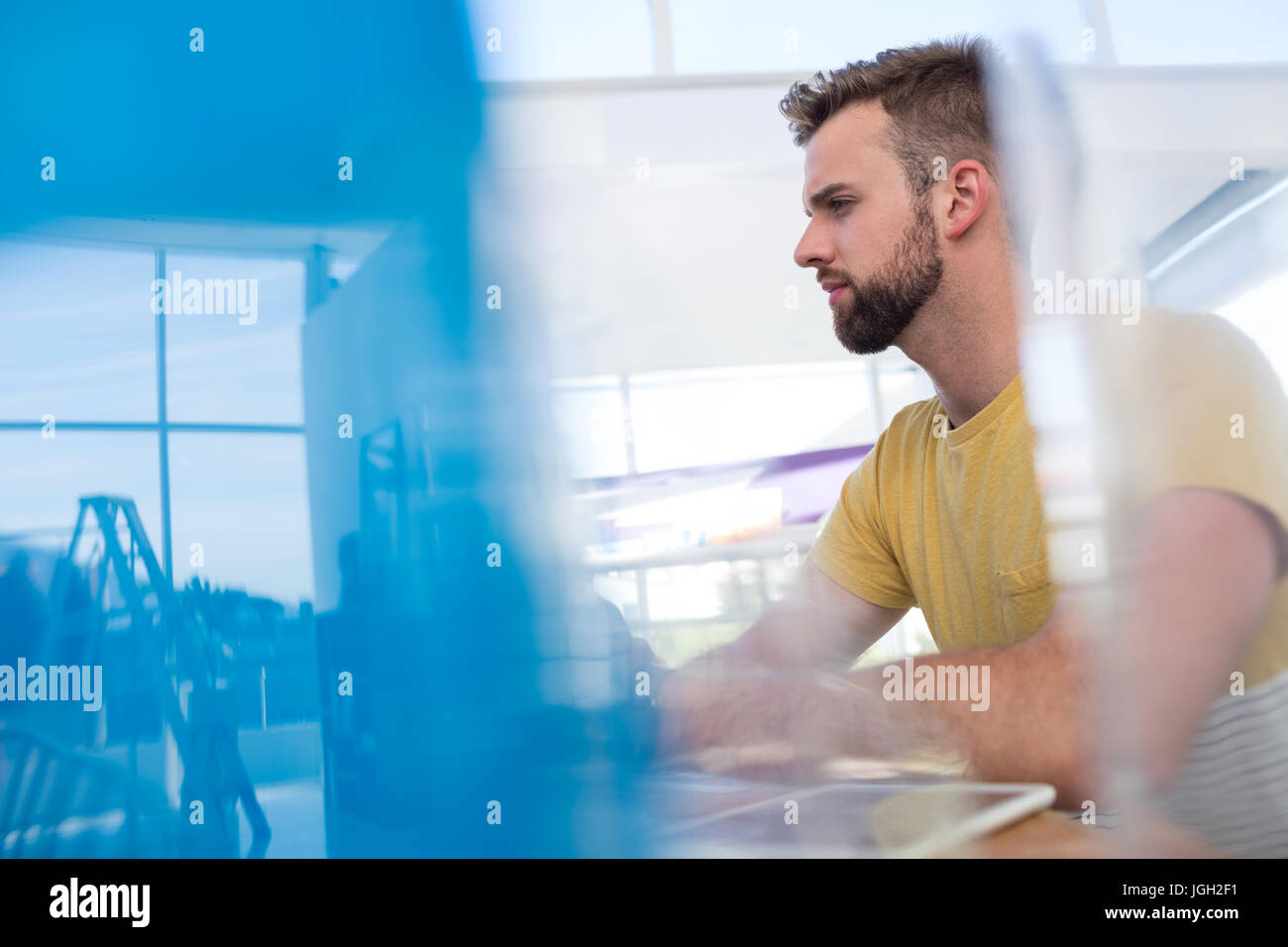 Male executive working on computer at desk in the office Stock Photo ...