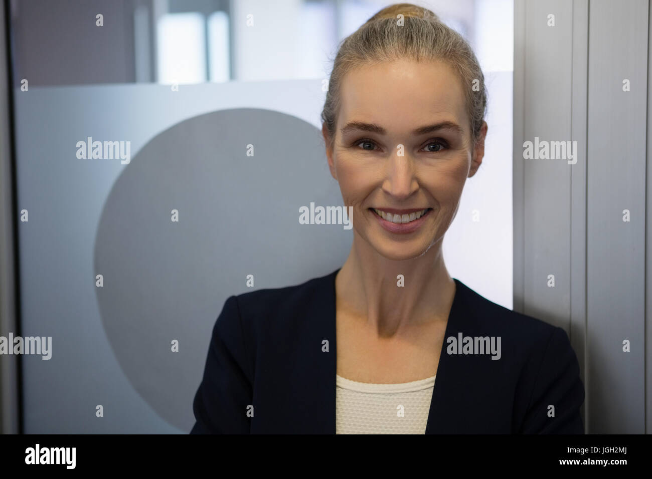 Woman answering door hi-res stock photography and images - Alamy