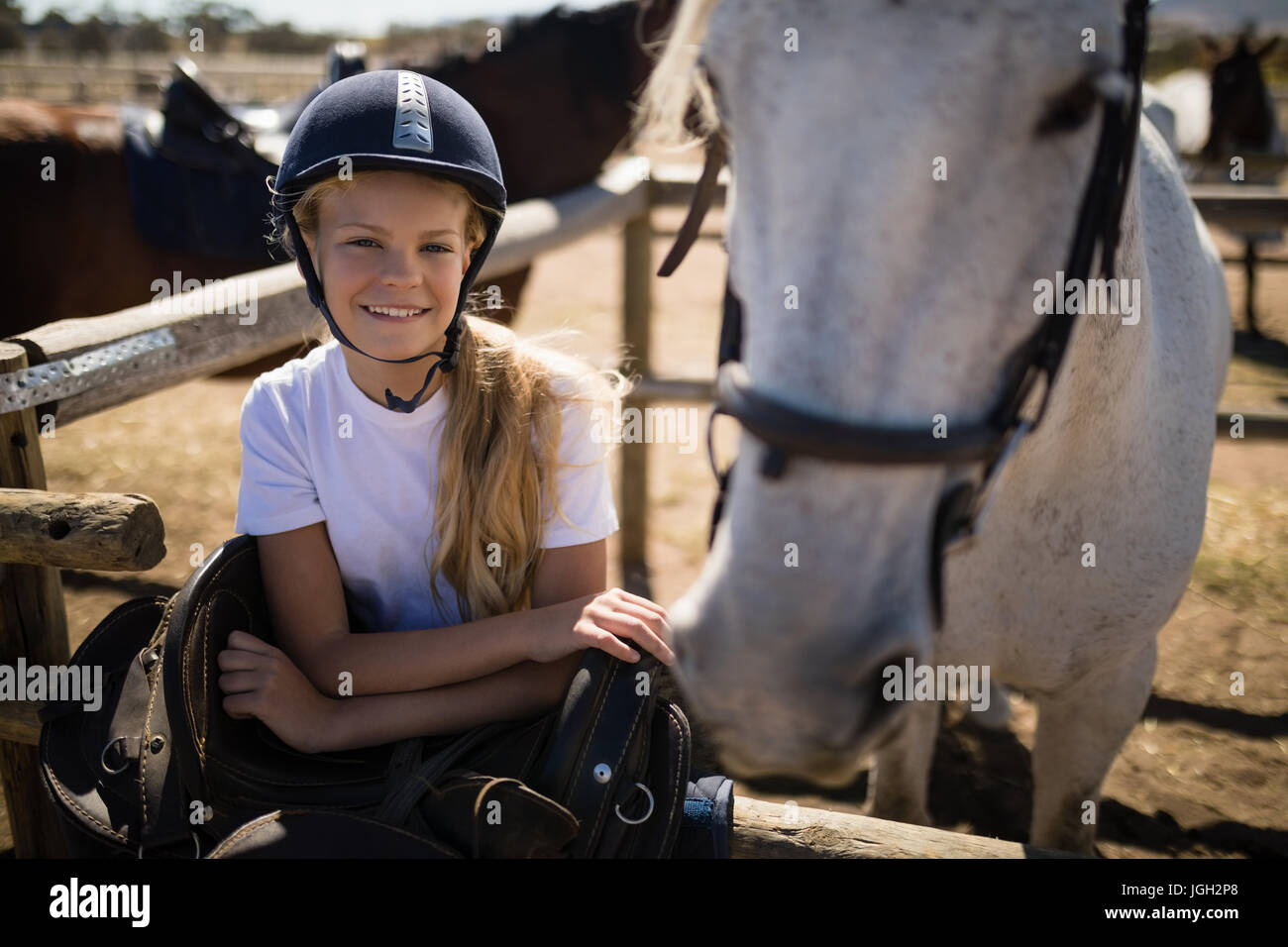 Boy leaning on fence hi-res stock photography and images - Alamy