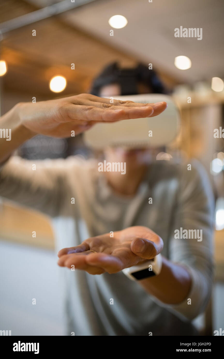 Smiling man using virtual reality headset in restaurant Stock Photo - Alamy