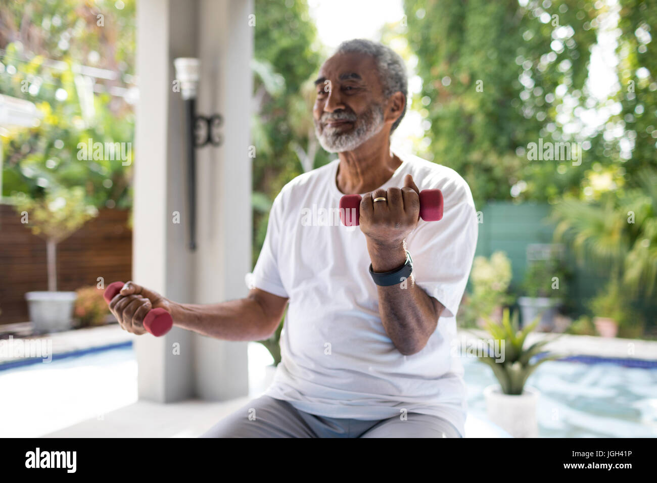 Senior man lifting dumbbell hi-res stock photography and images - Alamy