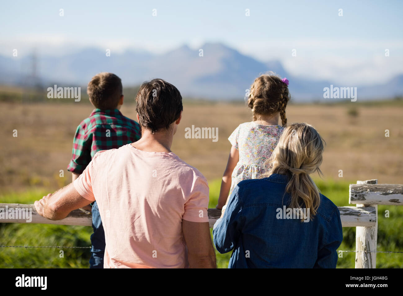 Rear view of family looking at nature in the park on a sunny day on a ...