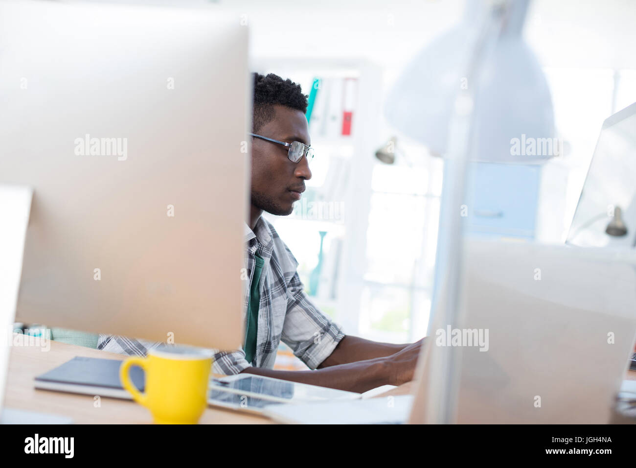 Attentive executive working on computer in office Stock Photo - Alamy