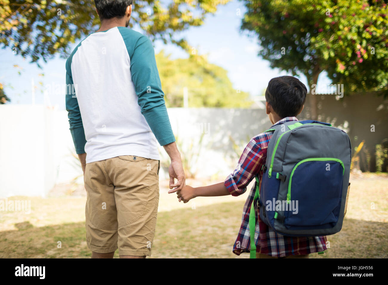 Back view man holding child hand hi-res stock photography and images ...