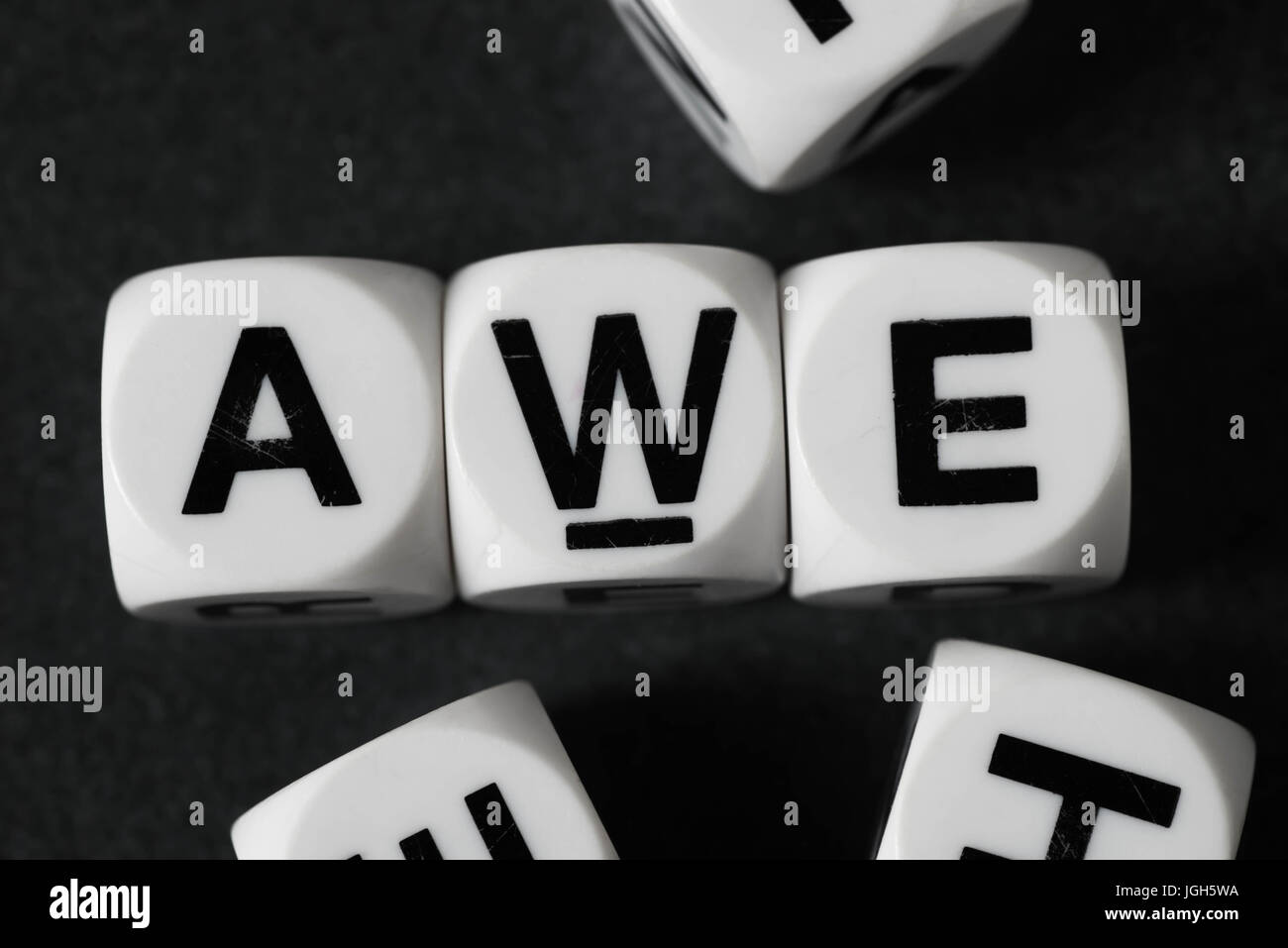 word awe on white toy cubes Stock Photo - Alamy