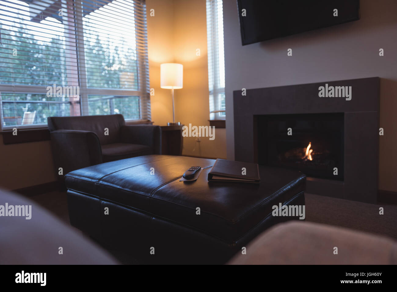 Interior of modern living room with fireplace Stock Photo - Alamy