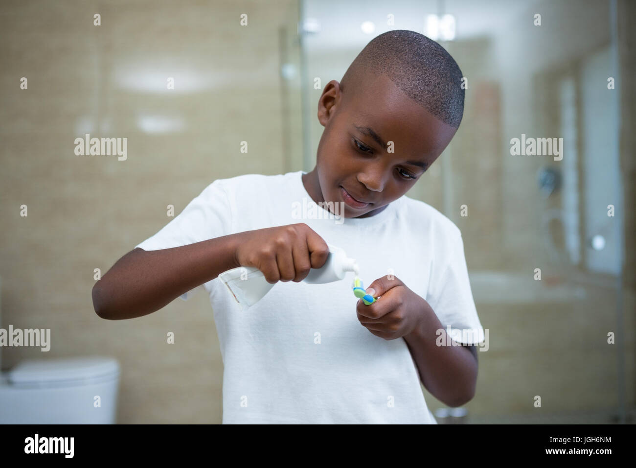 Black boy brushing hair hi-res stock photography and images - Alamy