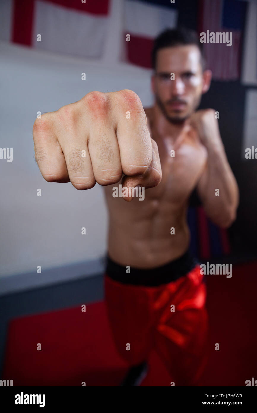 Determined man practicing boxing in fitness studio Stock Photo - Alamy