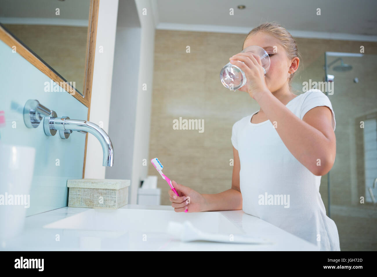 Child brushing teeth sink water hi-res stock photography and images - Alamy