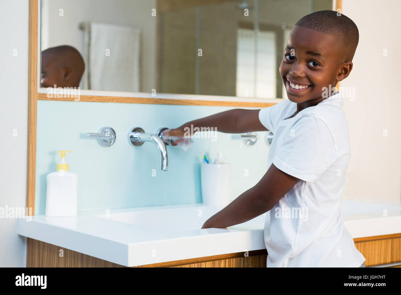 Boy Standing In Bathroom Washing Stock Photos & Boy Standing In ...