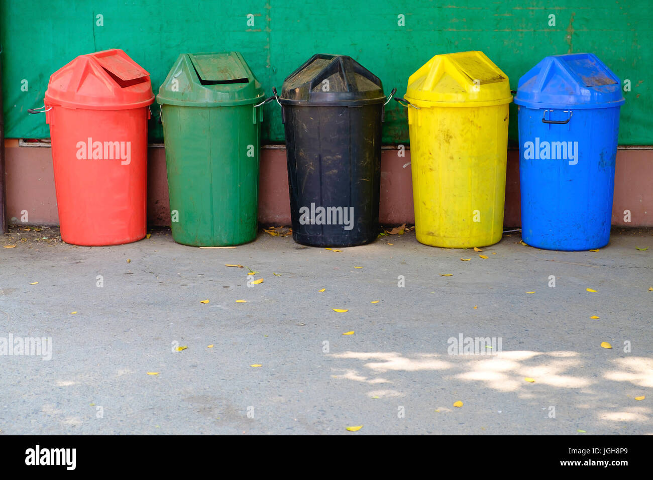 five colors dirty plastic recycle bins or trash can in the city Stock ...