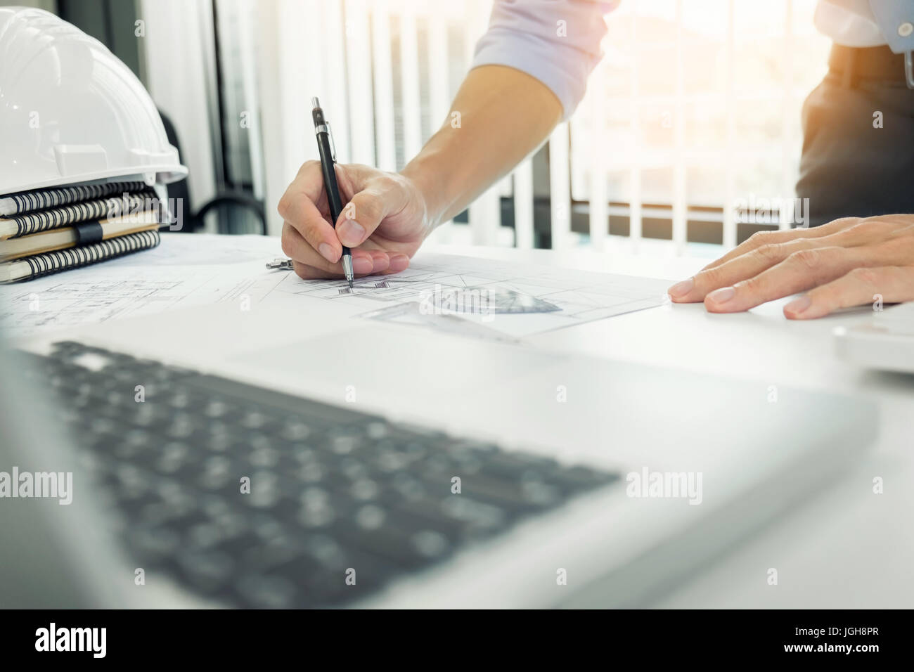 Person's engineer Hand Drawing Plan On Blue Print with architect ...