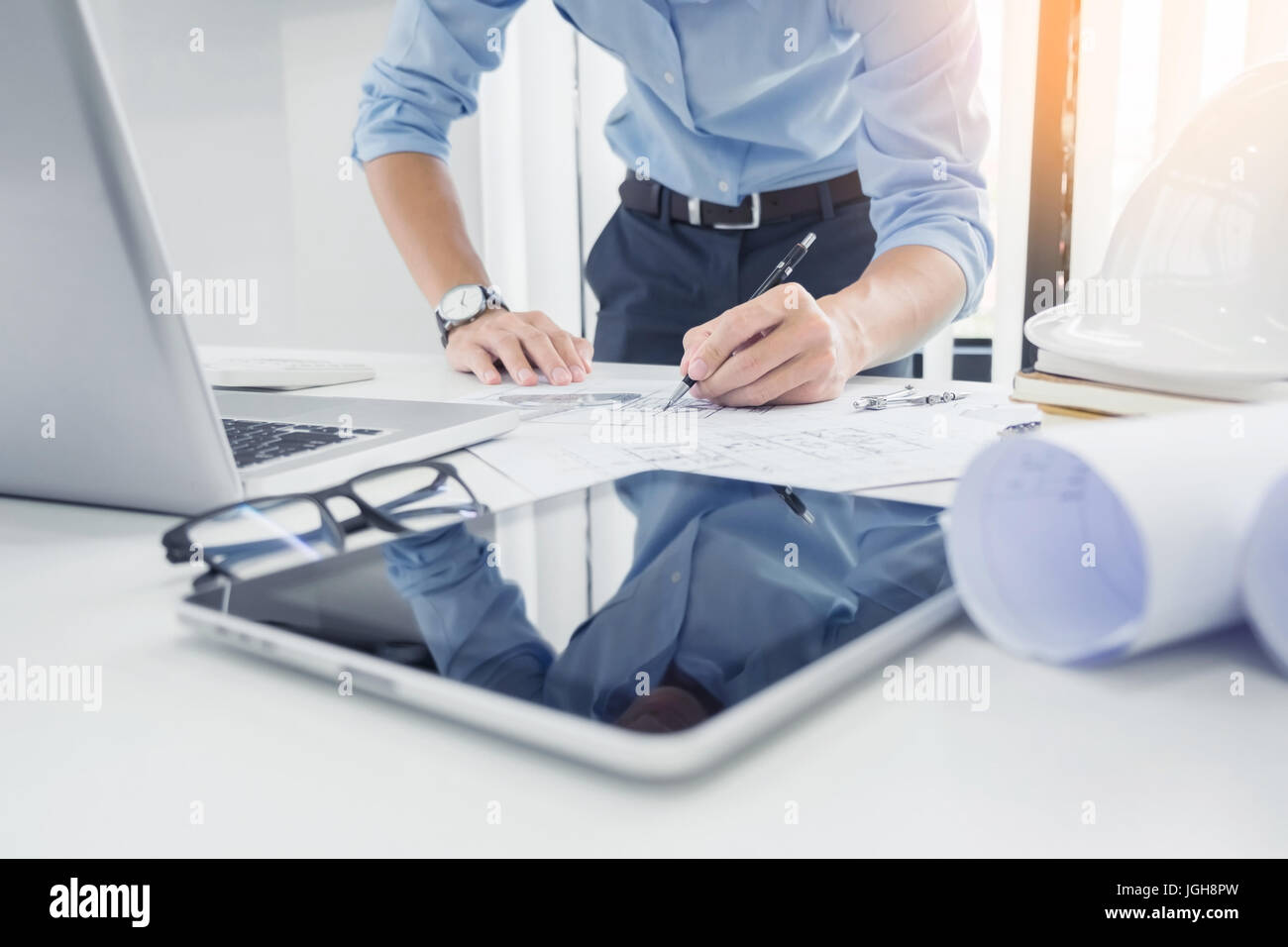 Person's engineer Hand Drawing Plan On Blue Print with architect ...