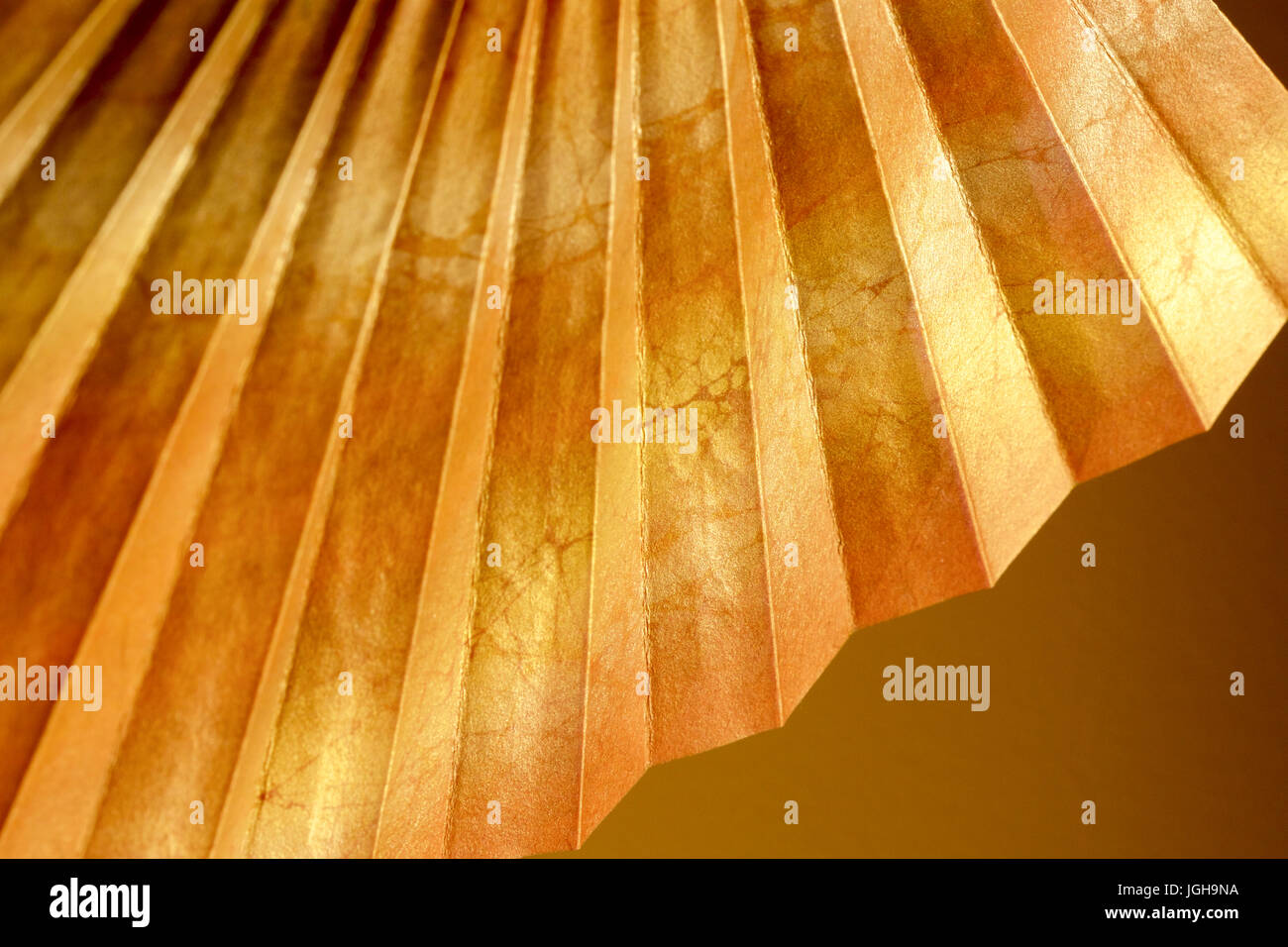 A golden Japanese fan Stock Photo - Alamy