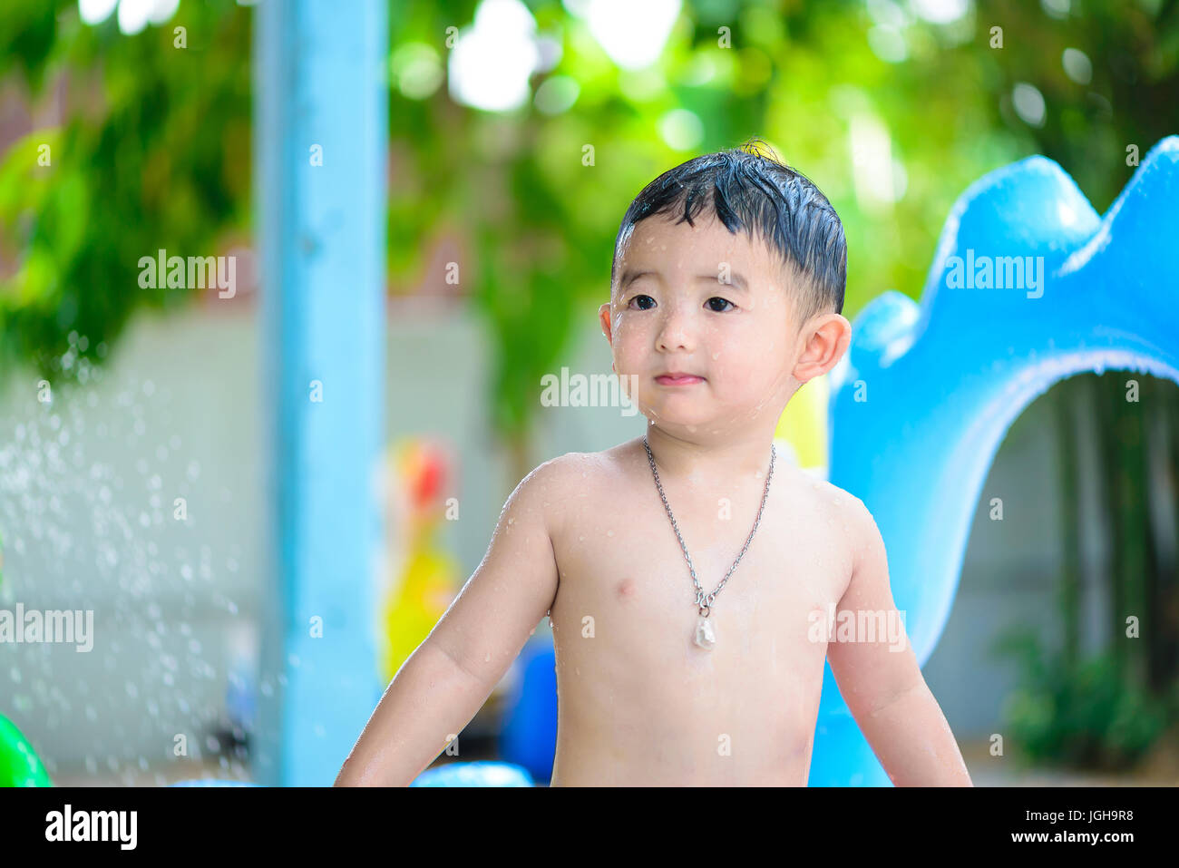 Asian boy playing in waterfall hi-res stock photography and images - Alamy