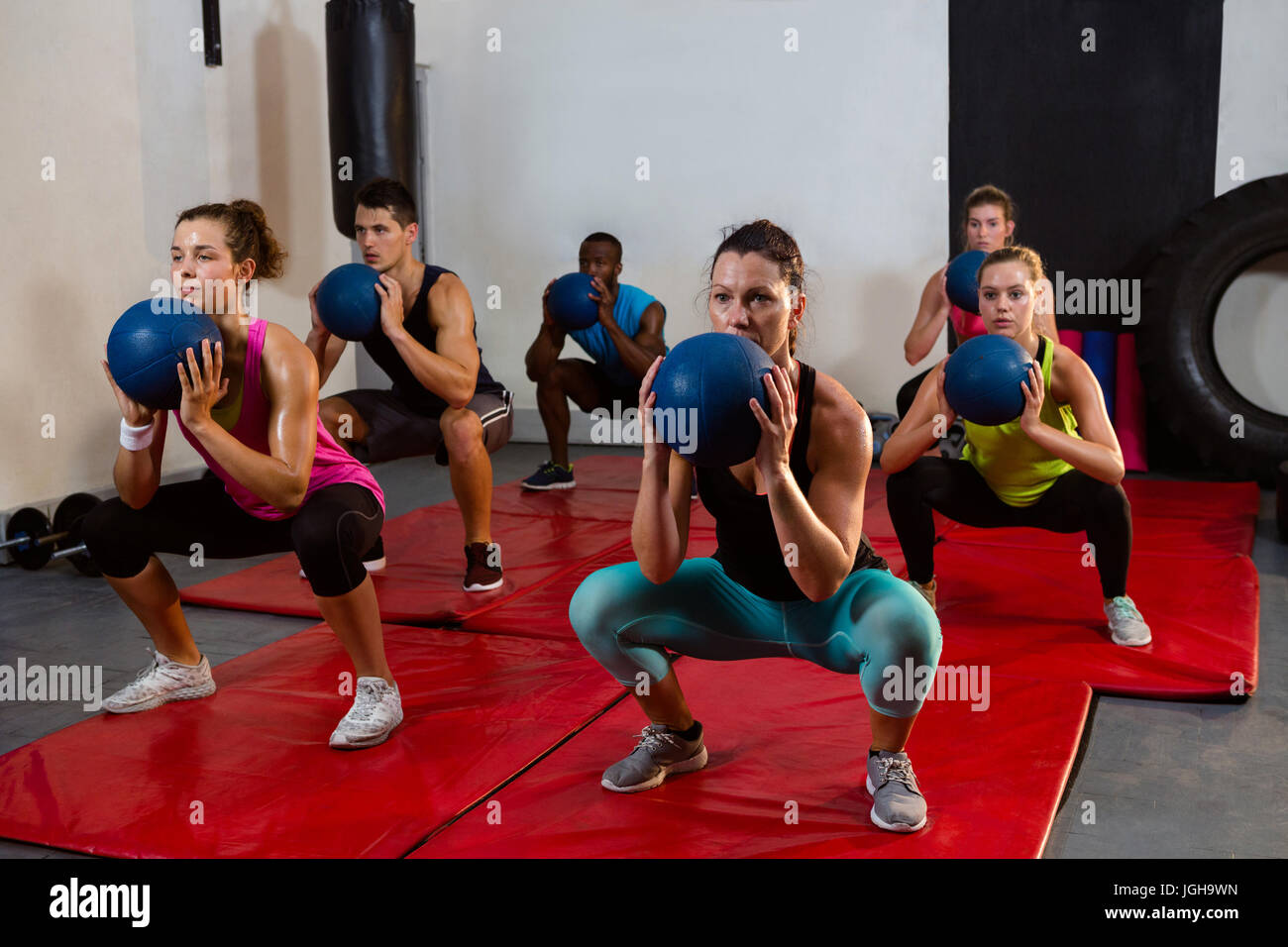 Young athletes crouching exercise hi-res stock photography and images ...