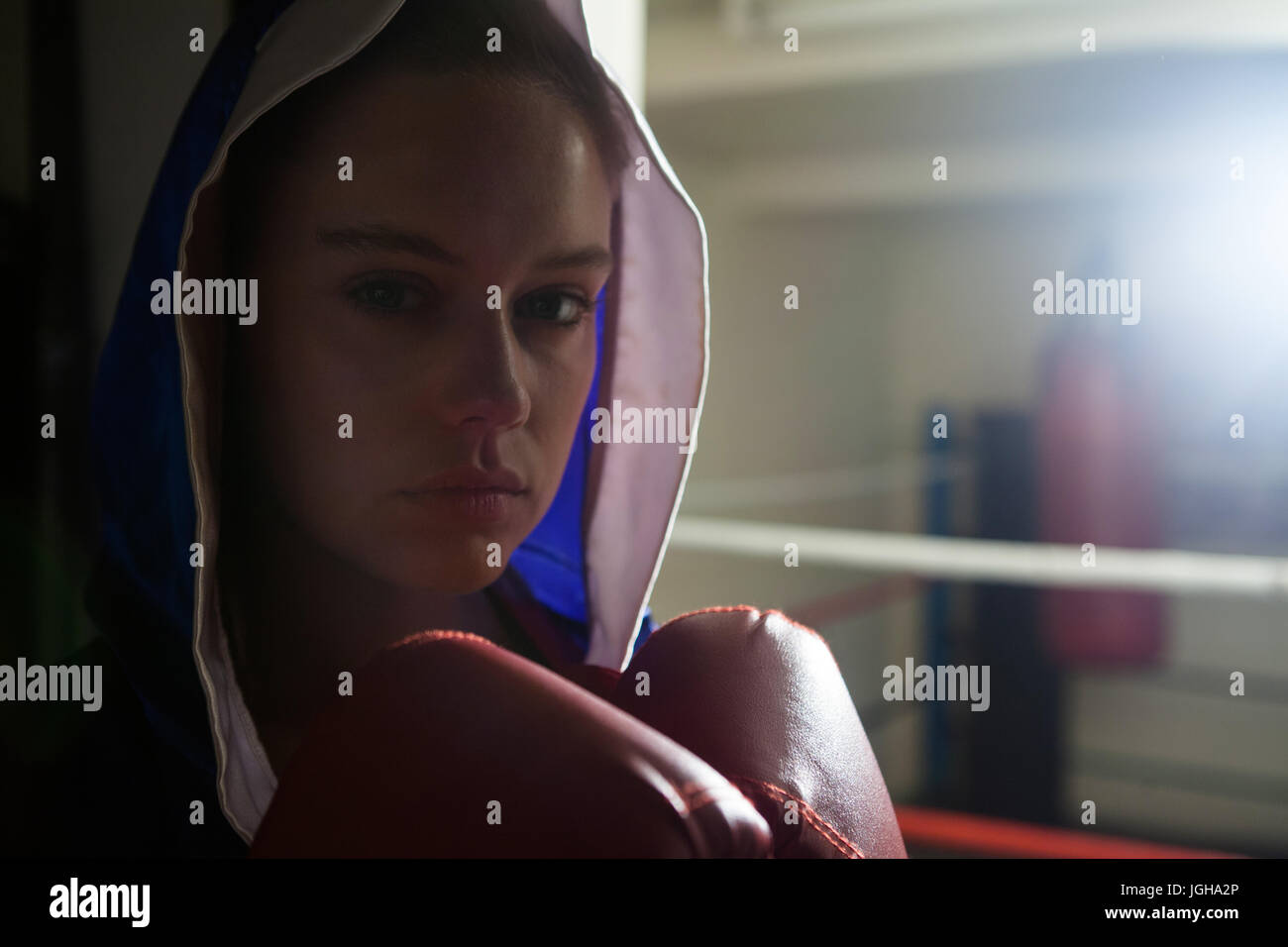 Beautiful woman practicing boxing in fitness studio Stock Photo - Alamy