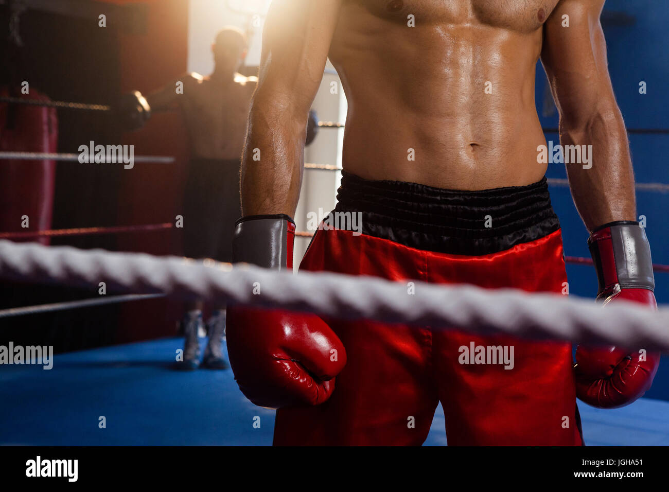 Boxers standing in boxing ring at fitness studio Stock Photo - Alamy