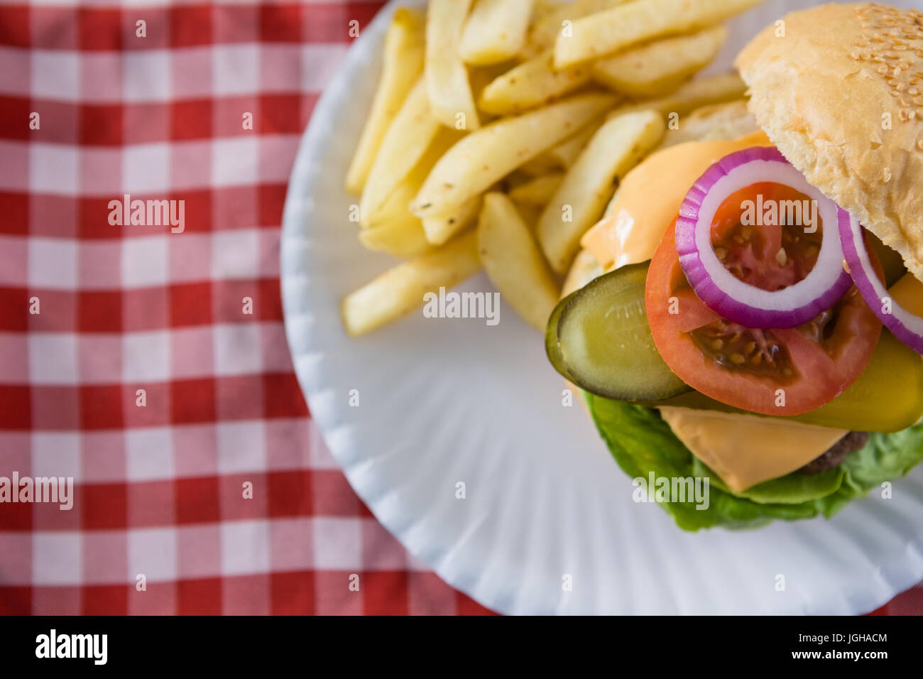 Overhead view of cheeseburger in plate Stock Photo - Alamy