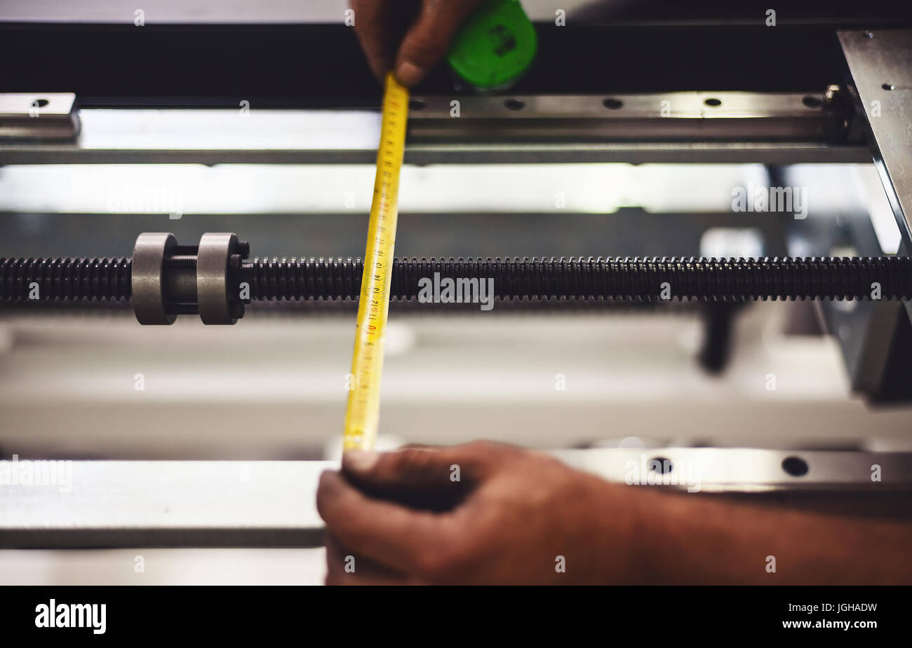 Details of manufacturing industrial machine, a worker and his meter ...