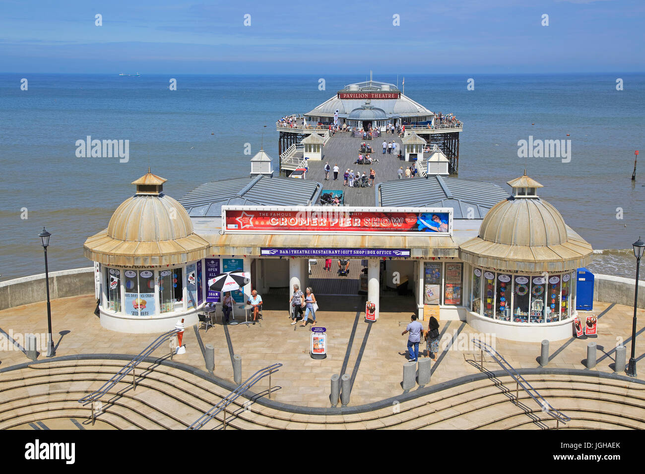 Sunny summer day sea beach and pier at Cromer, Norfolk, England, UK ...