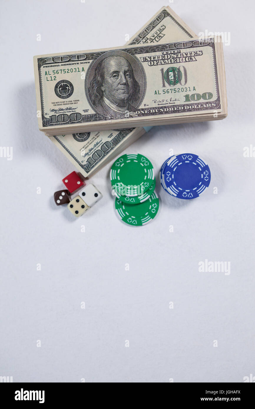 US dollars, dice and casino chips arranged on white background Stock ...