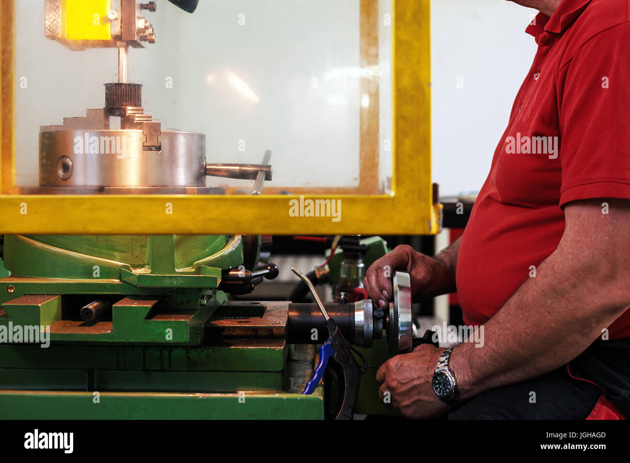 Worker in big industrial company, producing parts on his machine Stock ...
