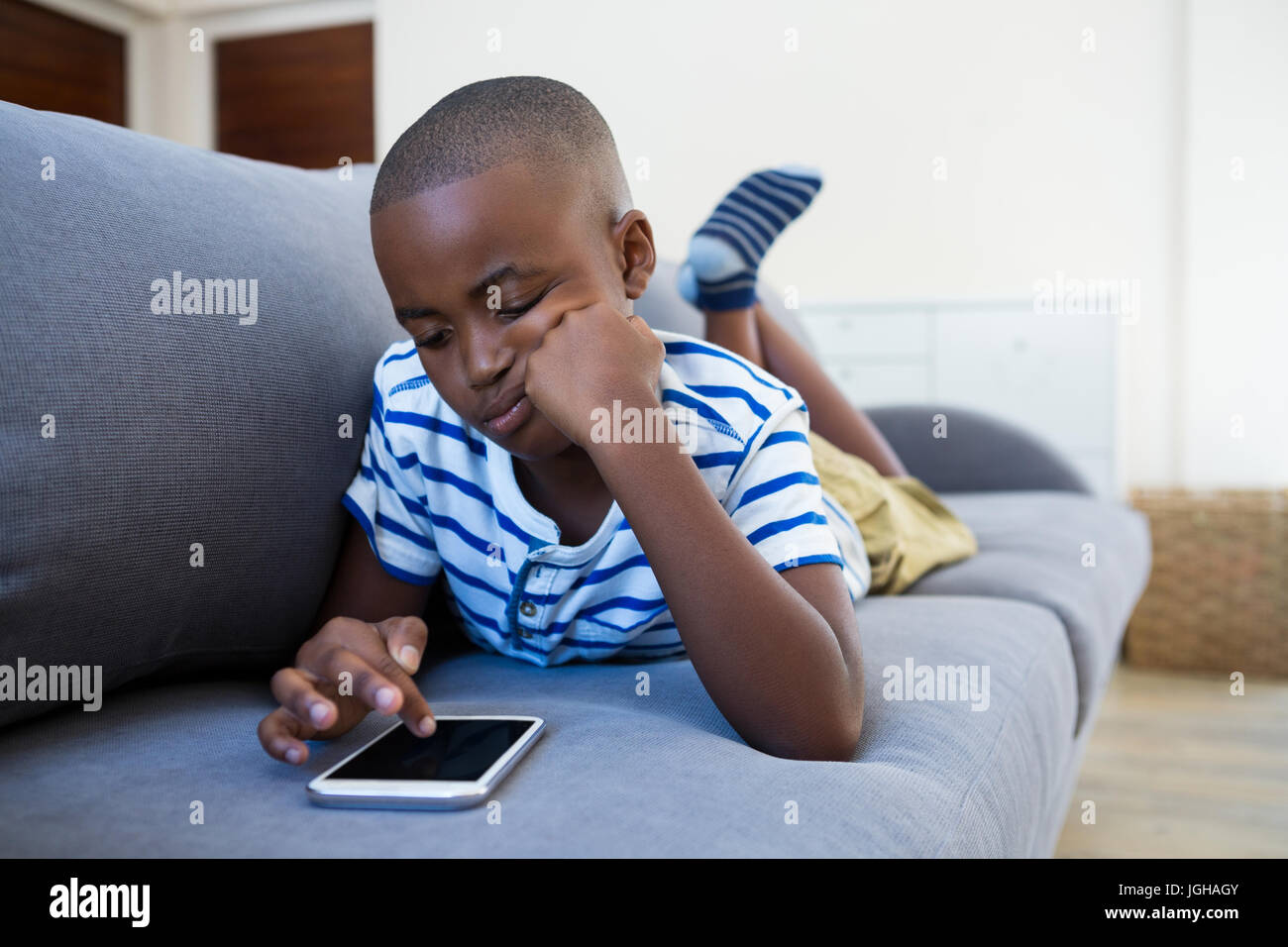 Bored Boy Sitting On Sofa High Resolution Stock Photography and Images ...
