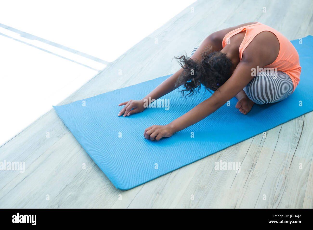 Girl sitting on exercising mat hi-res stock photography and images - Alamy