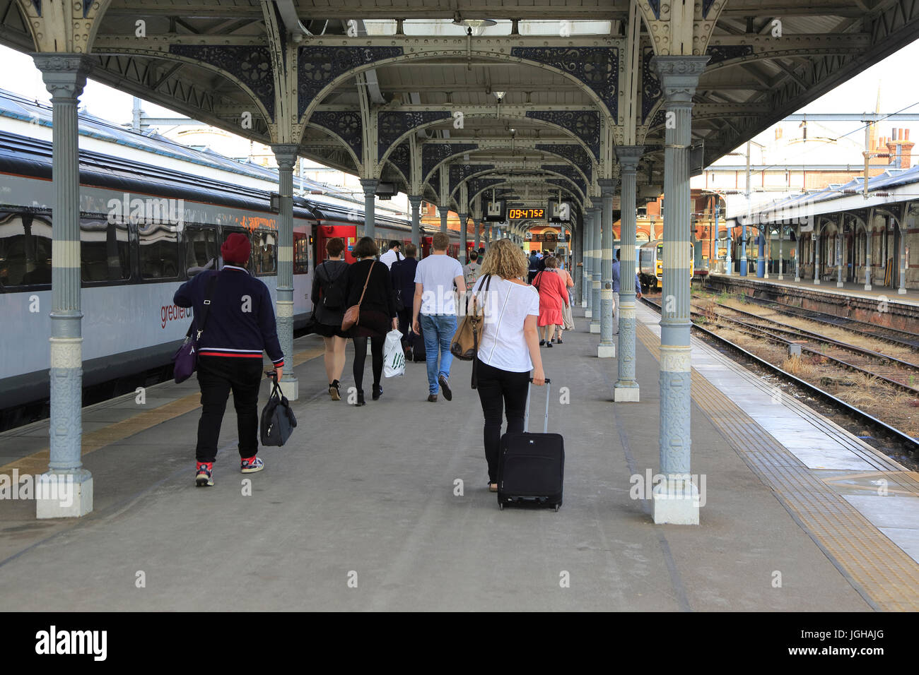Rail passengers on platform of railway train station, Norwich, Norfolk ...